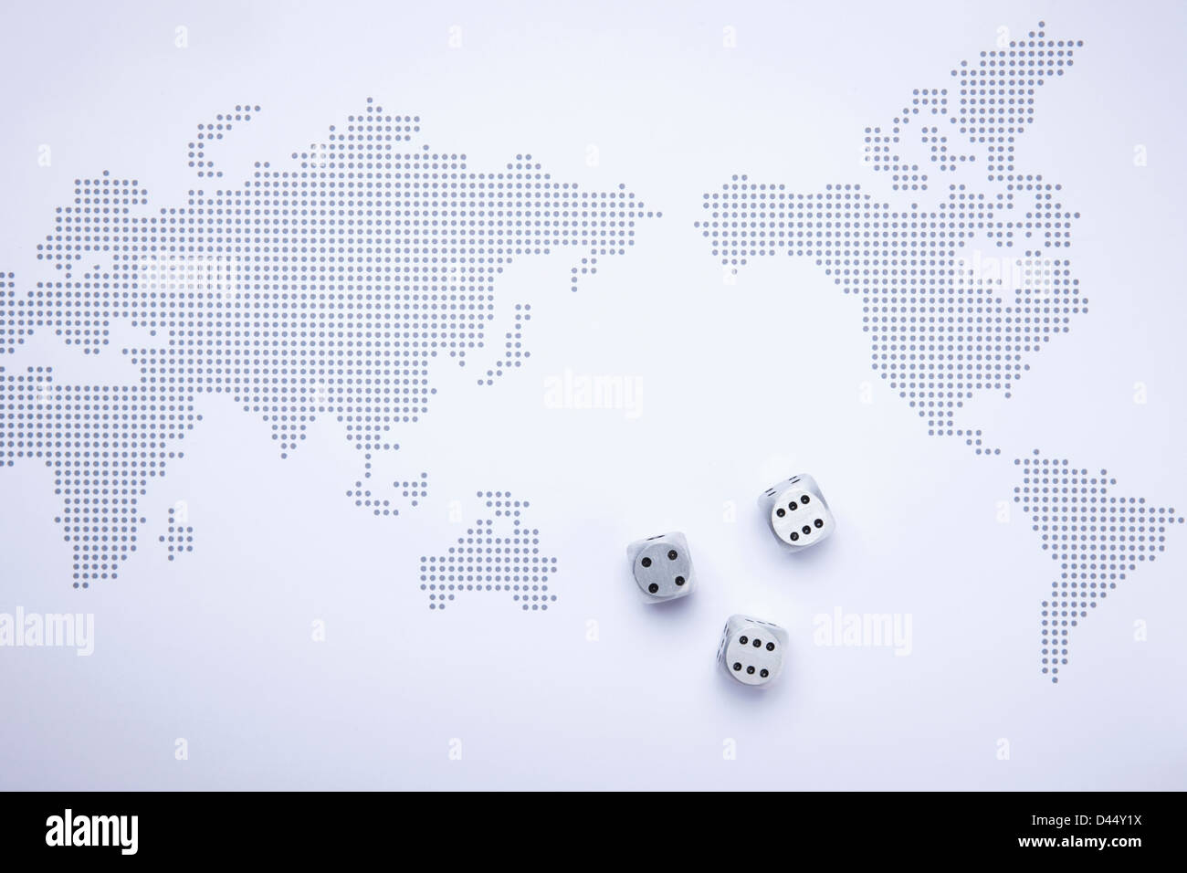 three dices on a world map Stock Photo - Alamy