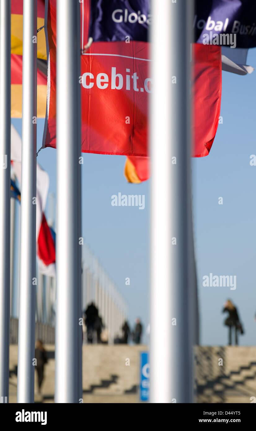 Flags are visible at the entrance to the world's largest computer expo ...