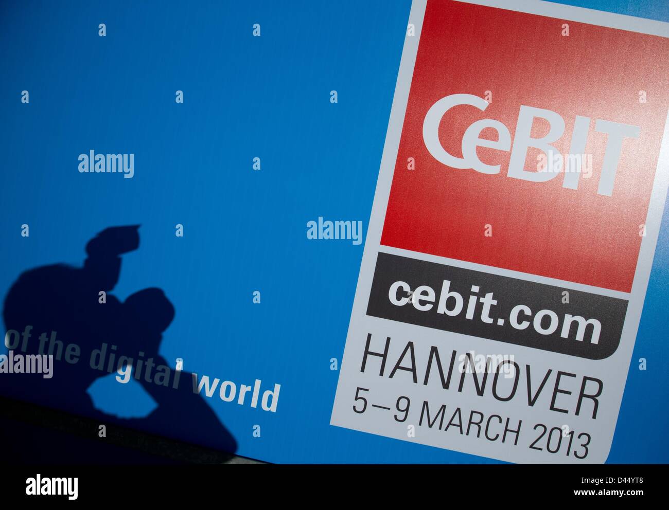 A person takes a picture of a banner of the world's largest computer ...