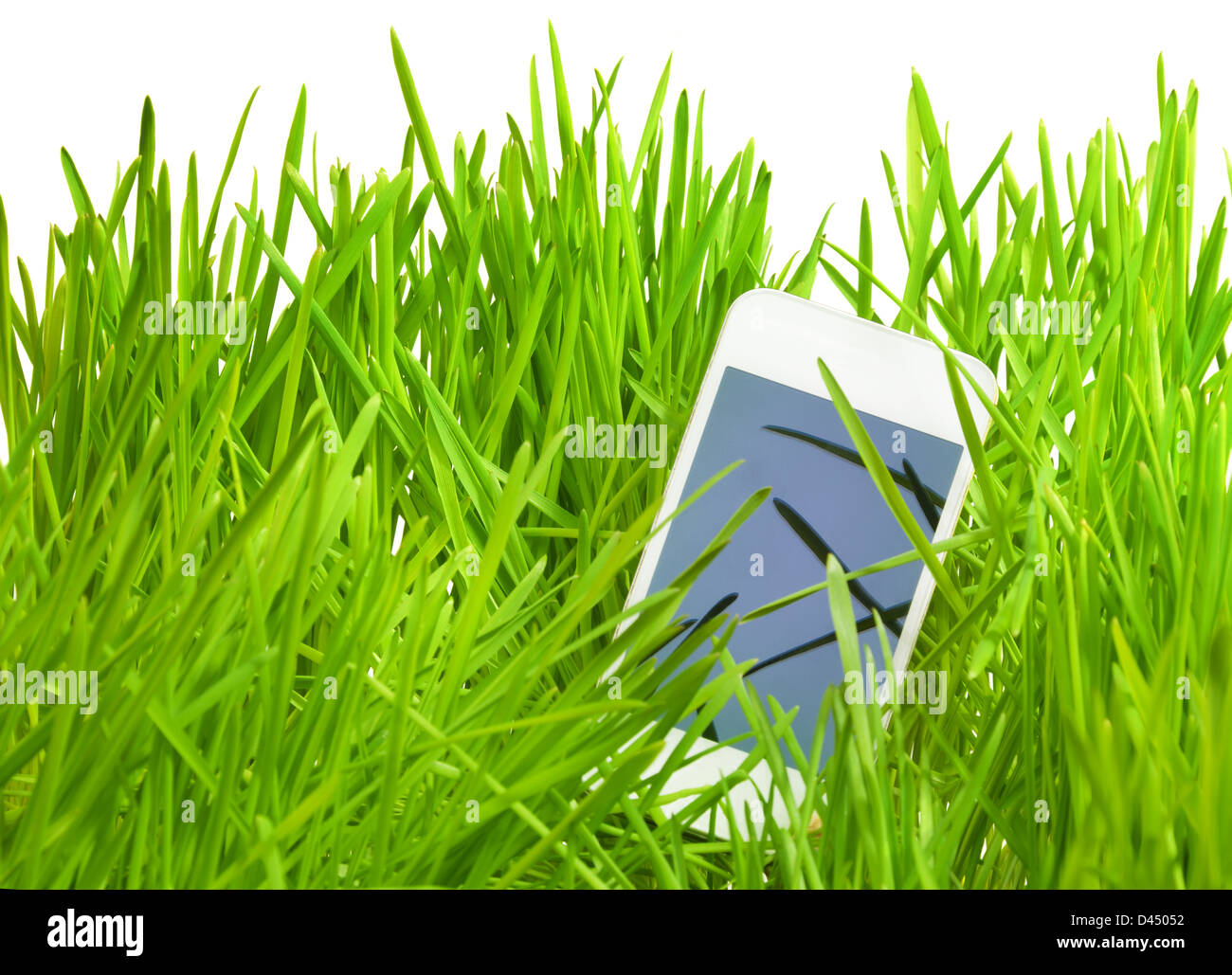 touch screen cell phone in grass - concept of spring sale Stock Photo ...