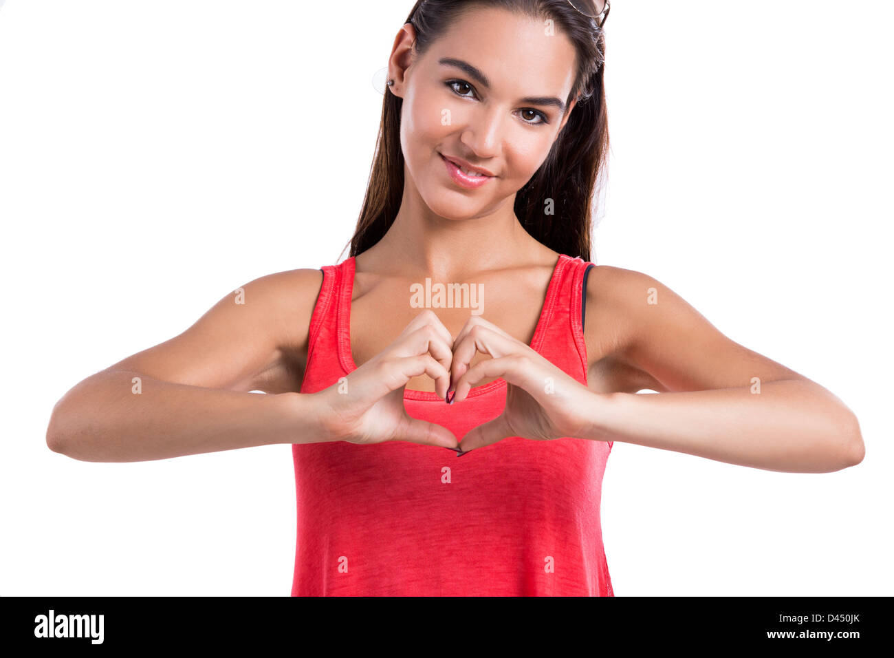 Beautiful woman making a heart symbol with her hands, isolated on white ...