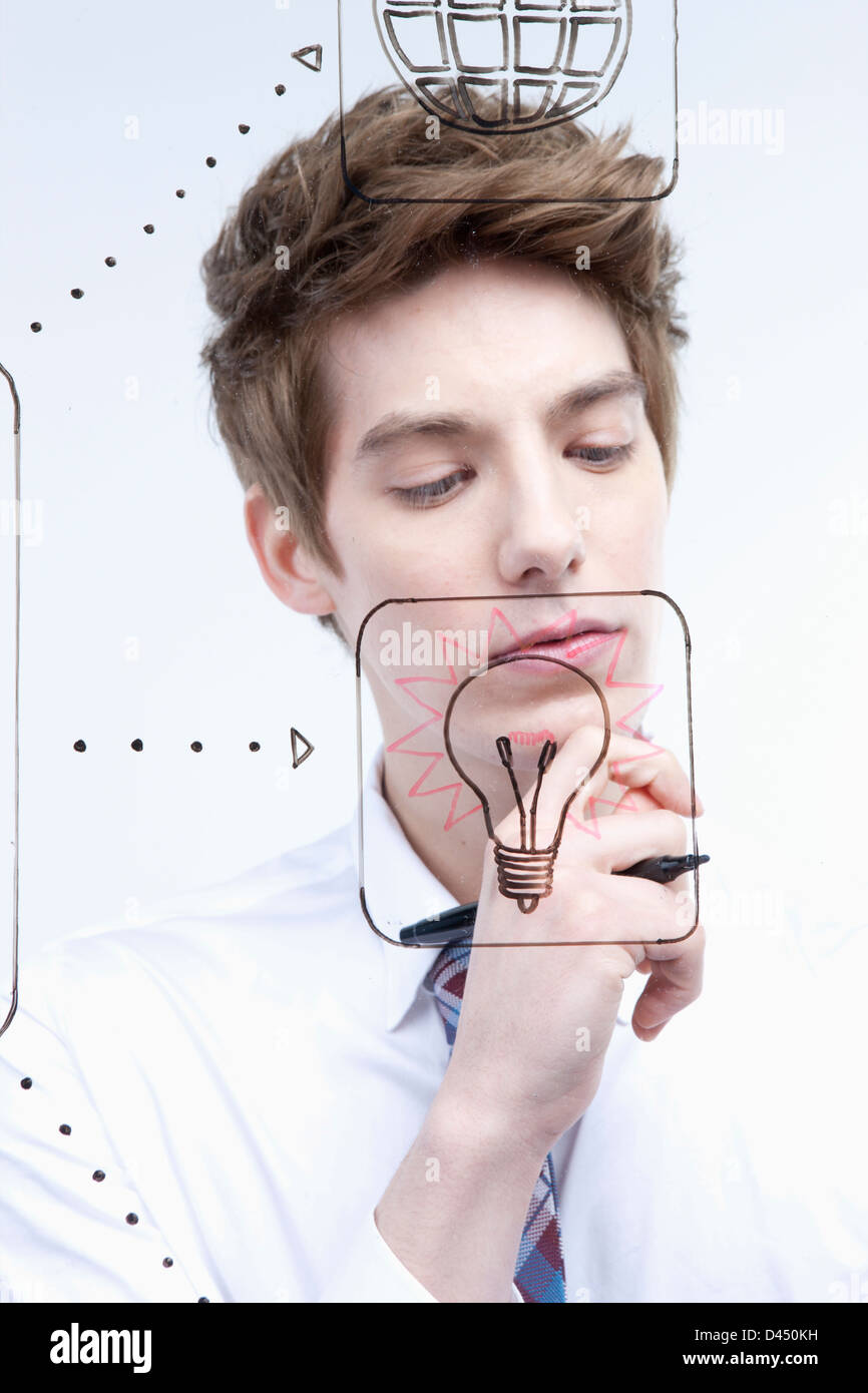 a western businessman writing on a transparent board Stock Photo - Alamy