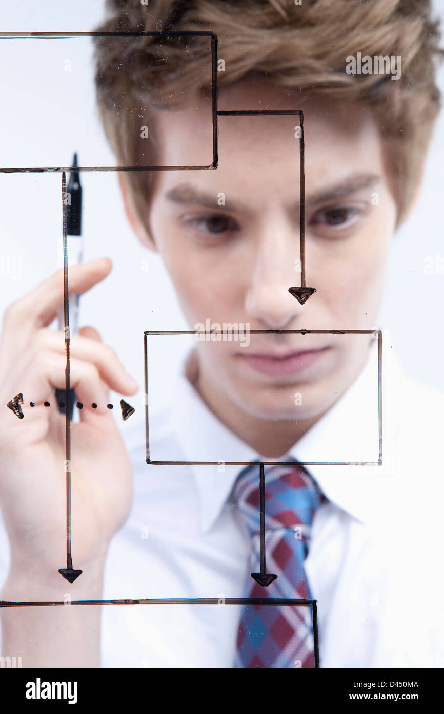 a western businessman writing on a transparent board Stock Photo - Alamy