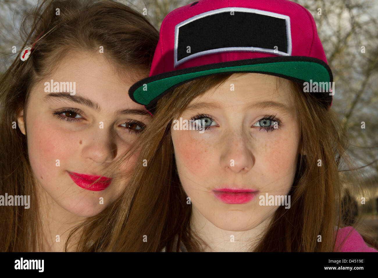 a close up of 2 teenagers teenagers hanging out playing young adult ...