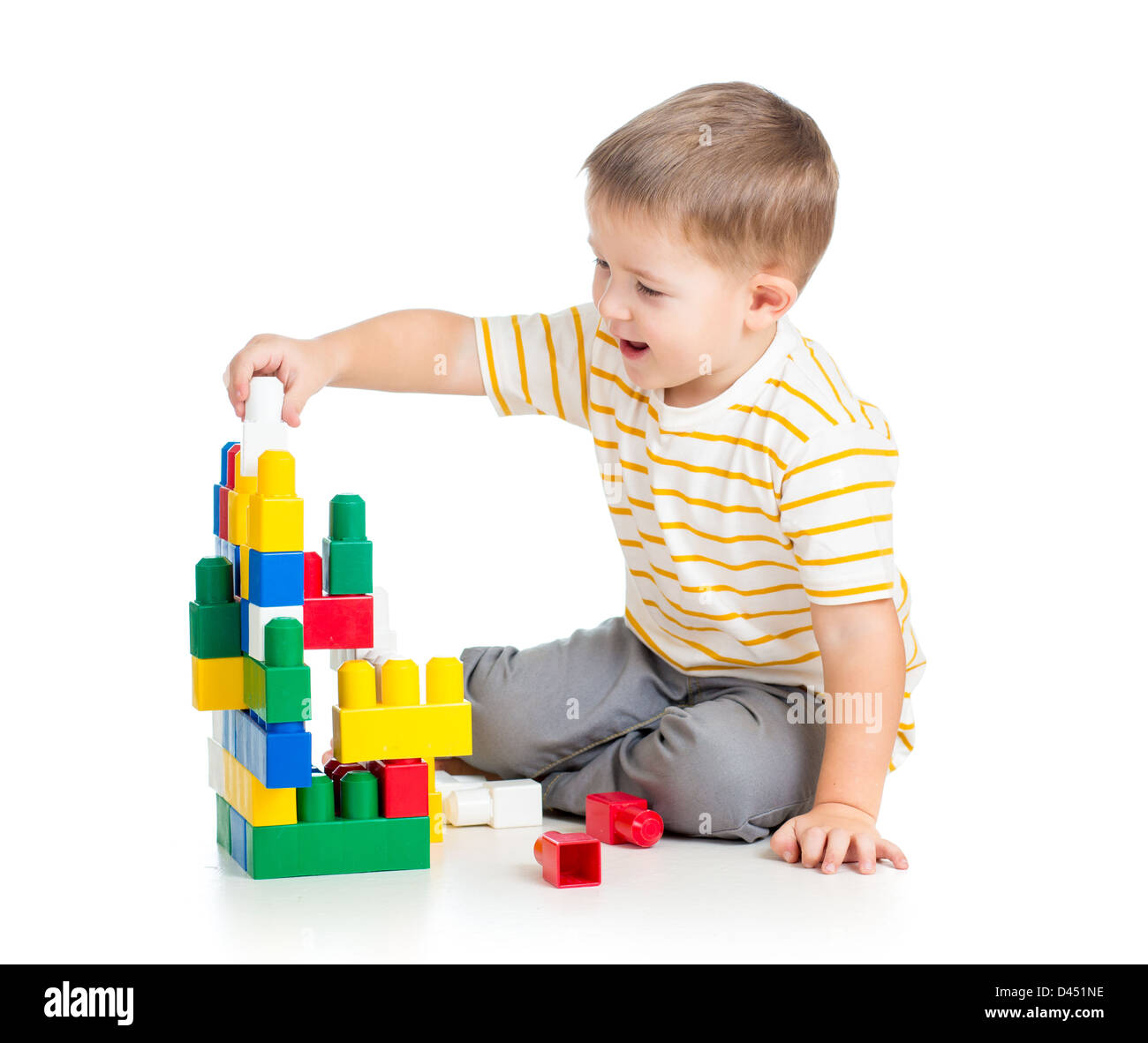 cheerful child boy with construction set over white background Stock ...