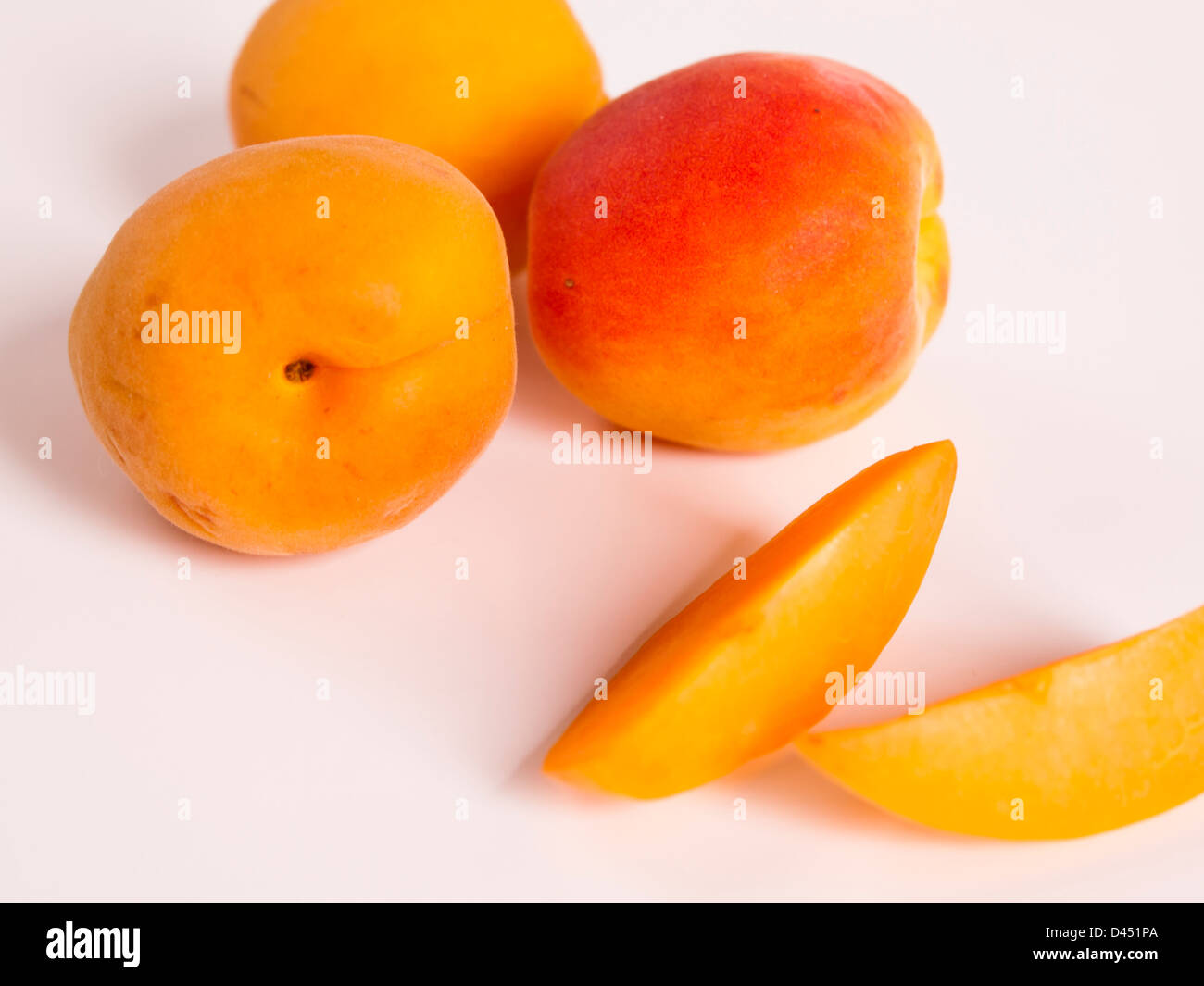 The apricot fruit is a drupe similar to a small peach, from yellow to ...
