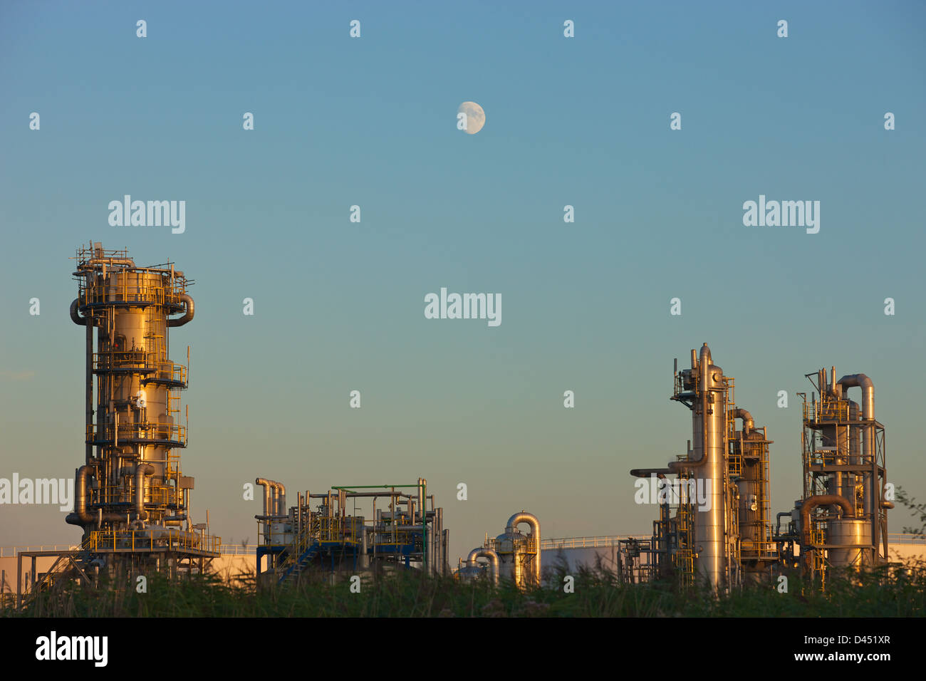 Moonlight over an oil refinery Stock Photo - Alamy