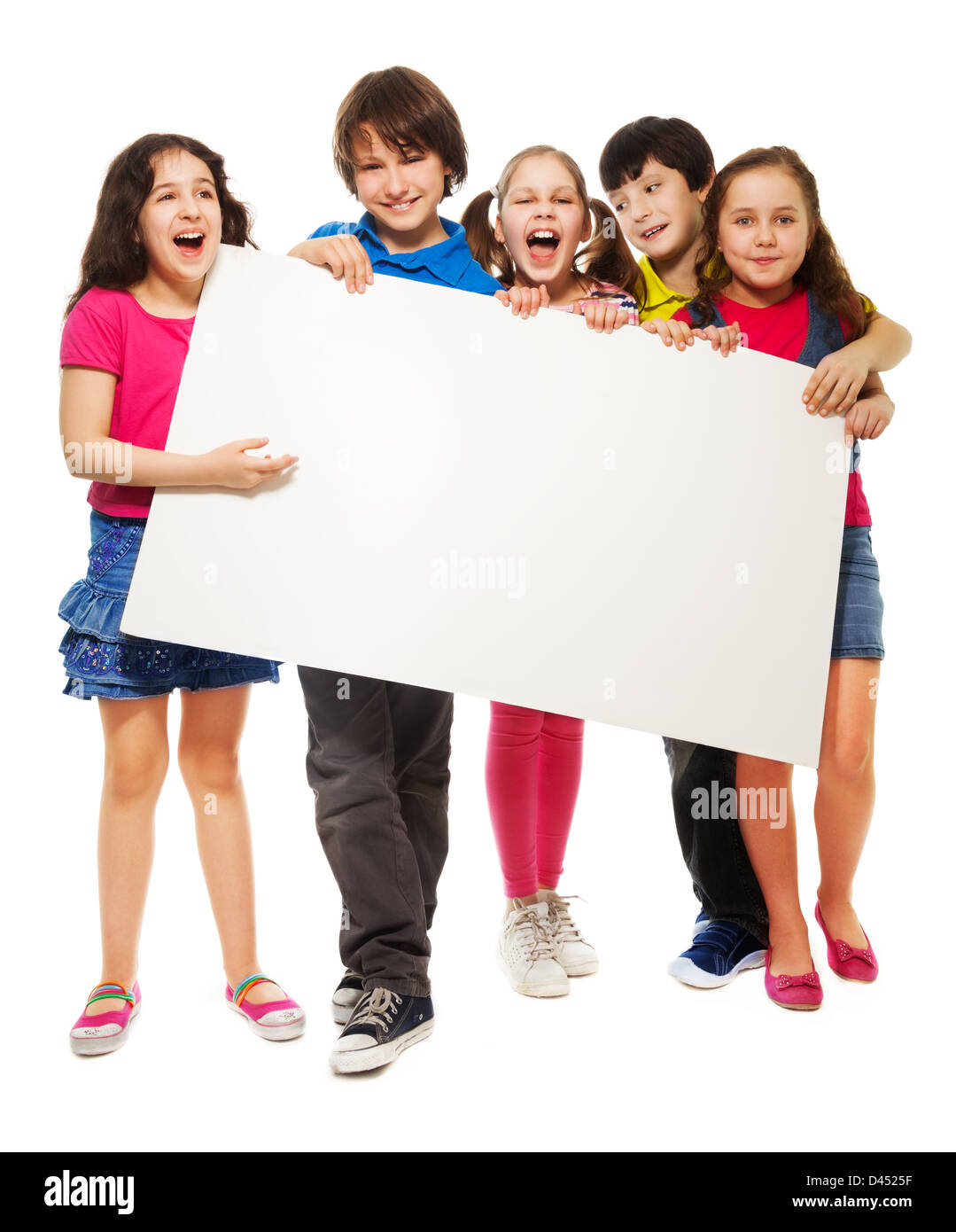 Happy smiling group of boys and girls, showing blank placard board to ...