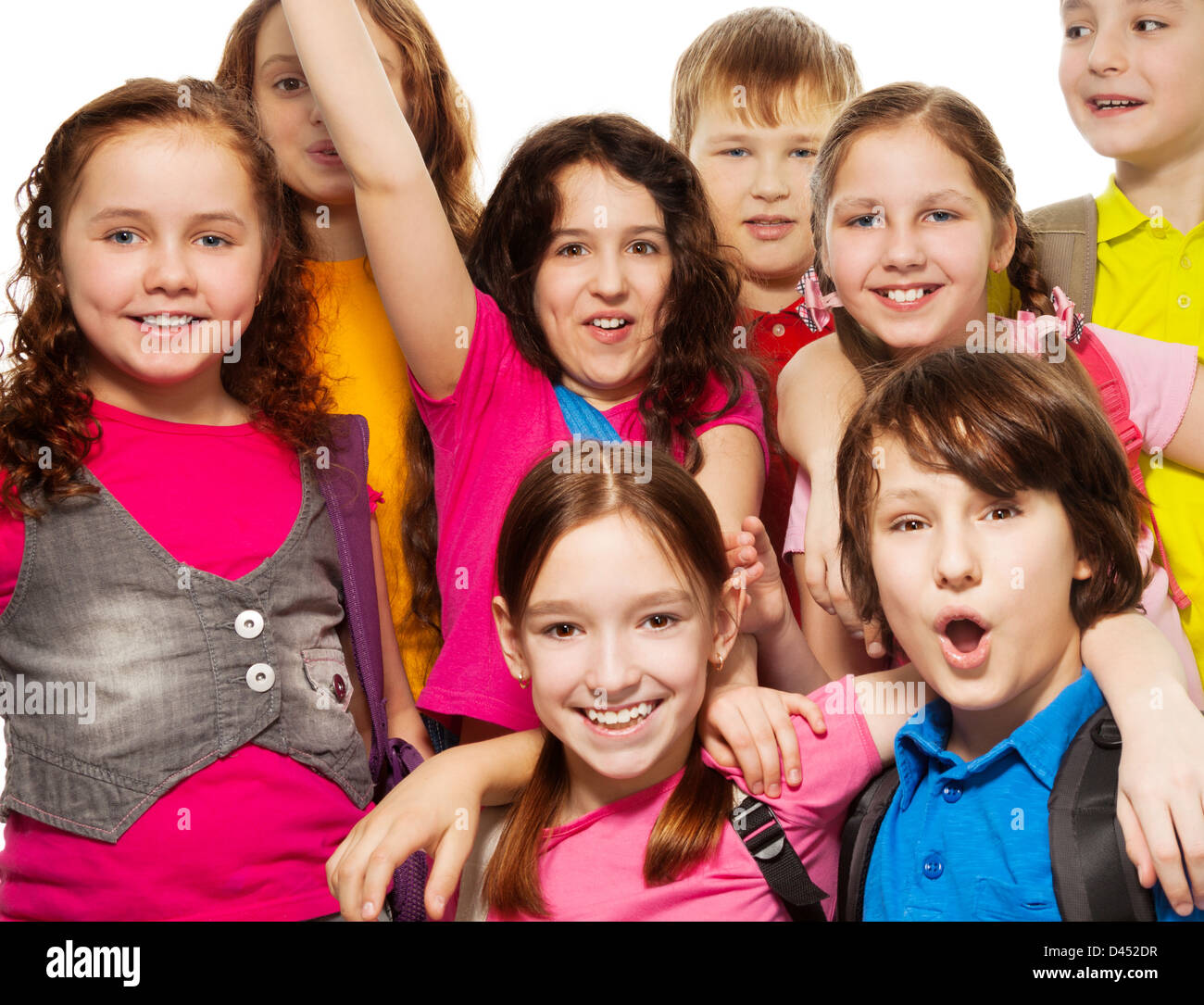Close-up of a group of 8 kids together with backpacks, smiling ...
