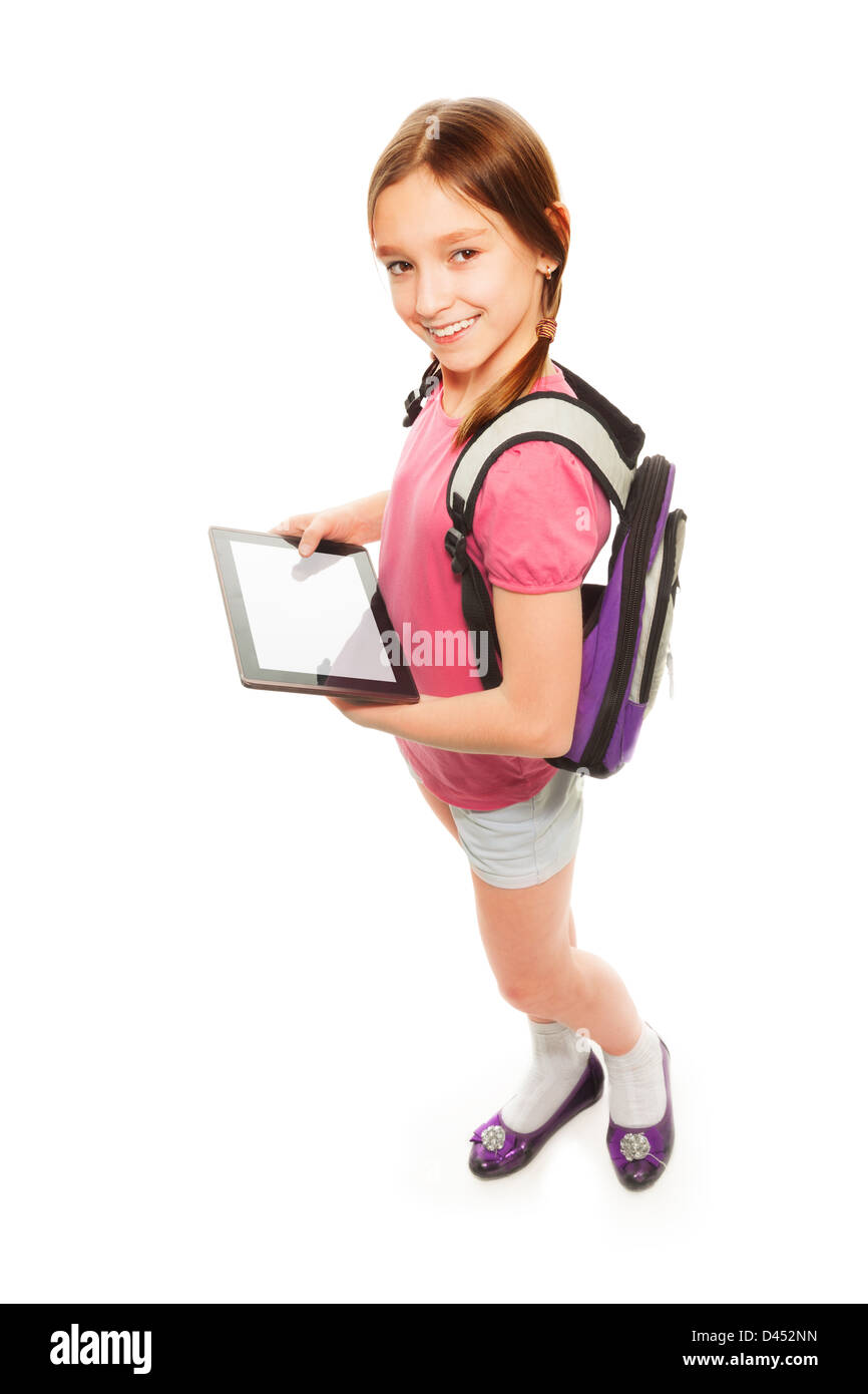 Smart Caucasian 9 years old girl holding digital tablet computer ...