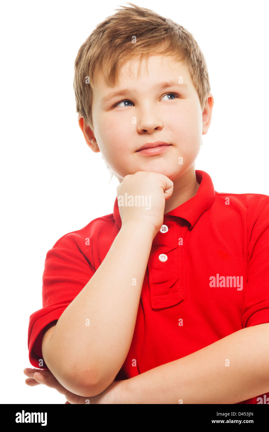 Happy thoughtful Caucasian boy with thinking expression, standing ...