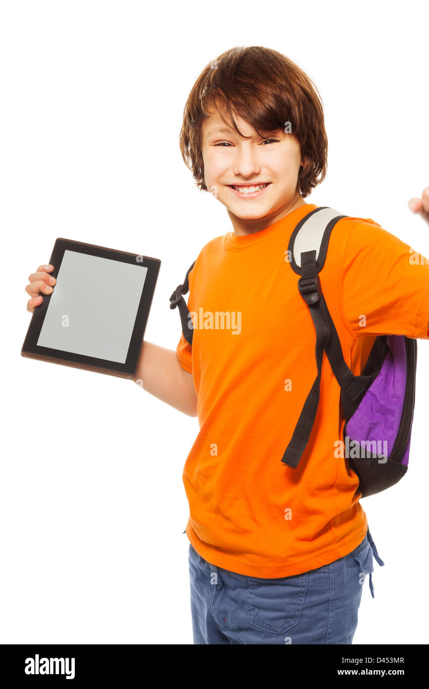 Happy and surprised Caucasian 11 years old boy with tablet computer ...