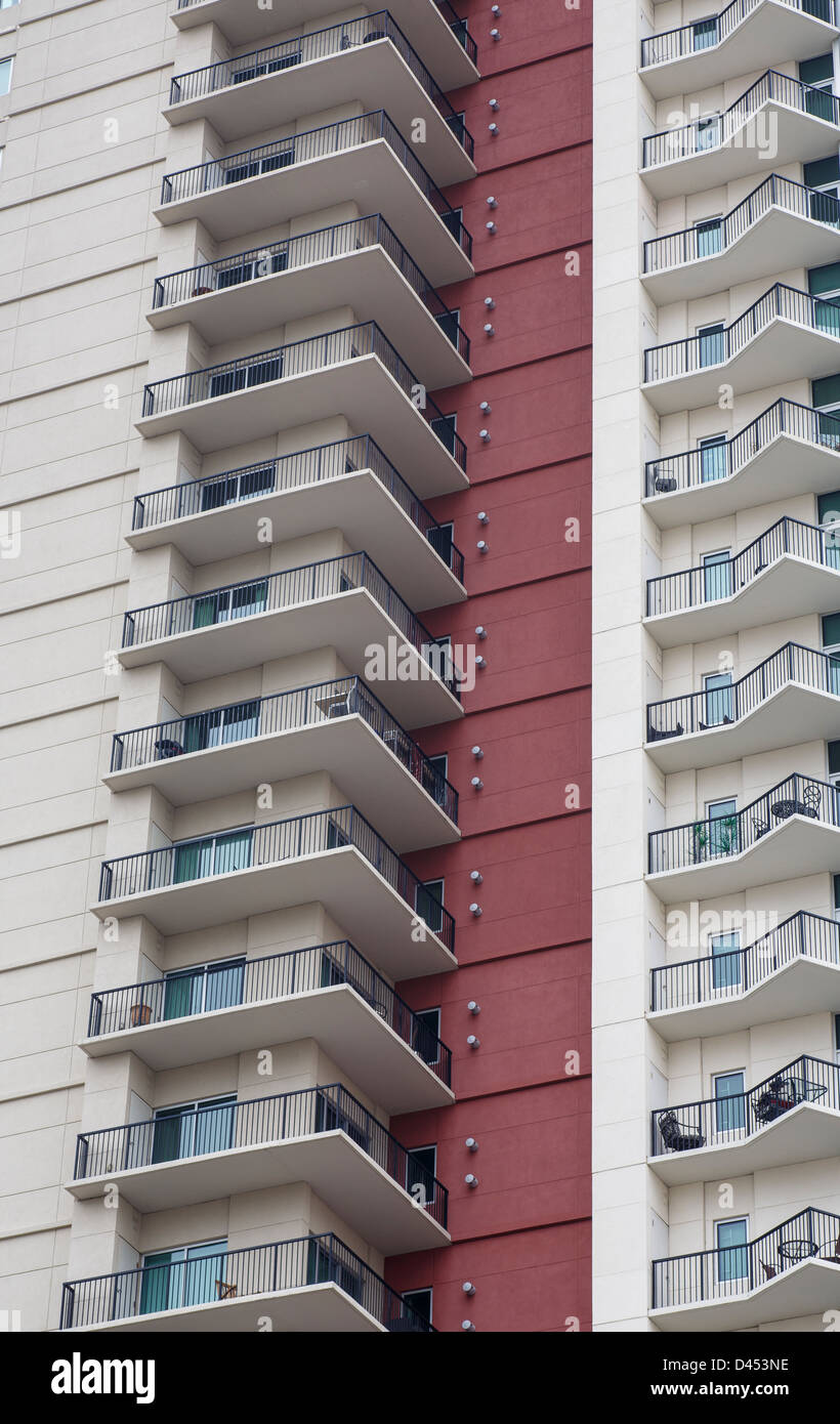 A column of balcones on a high rise condominium tower with a red stucco ...