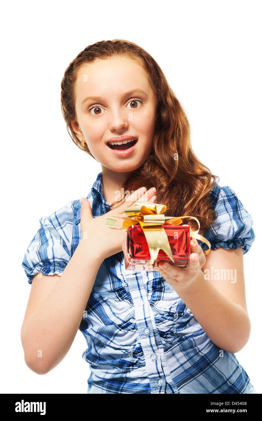 Happy surprised teen Caucasian girl holding small red present box with ...