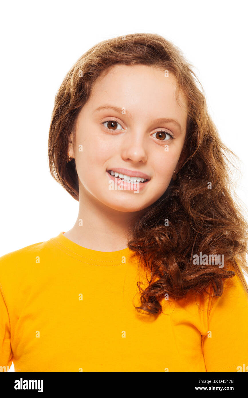 Close-up portrait of curly teen girl with curly hair, smiling, isolated ...