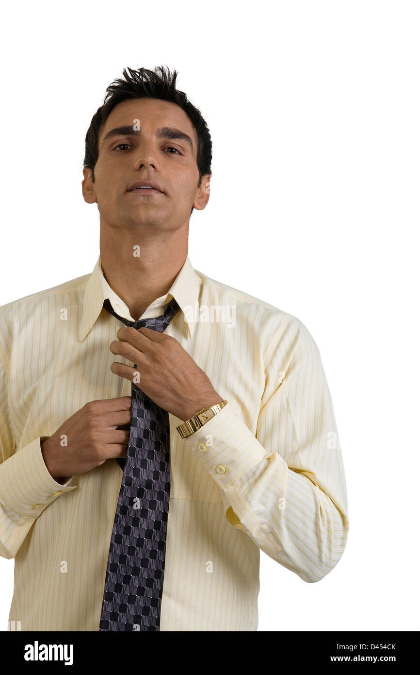 Portrait of a man getting dressed Stock Photo - Alamy