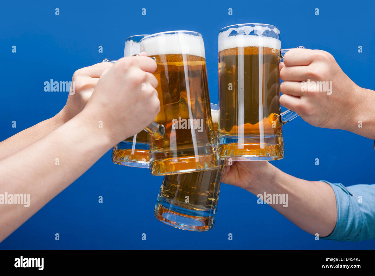 hands toasting with beer Stock Photo - Alamy