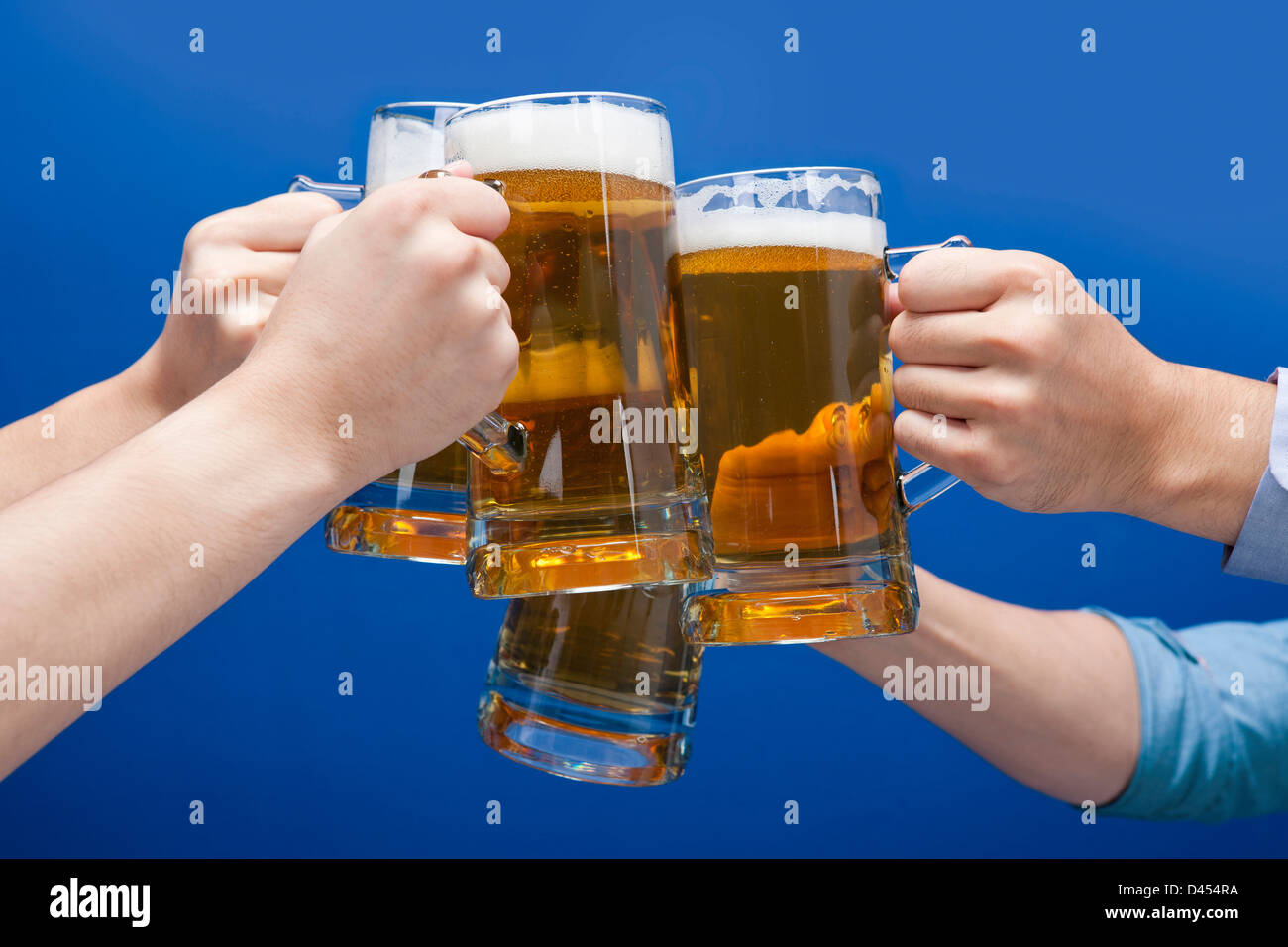 hands toasting with beer Stock Photo - Alamy
