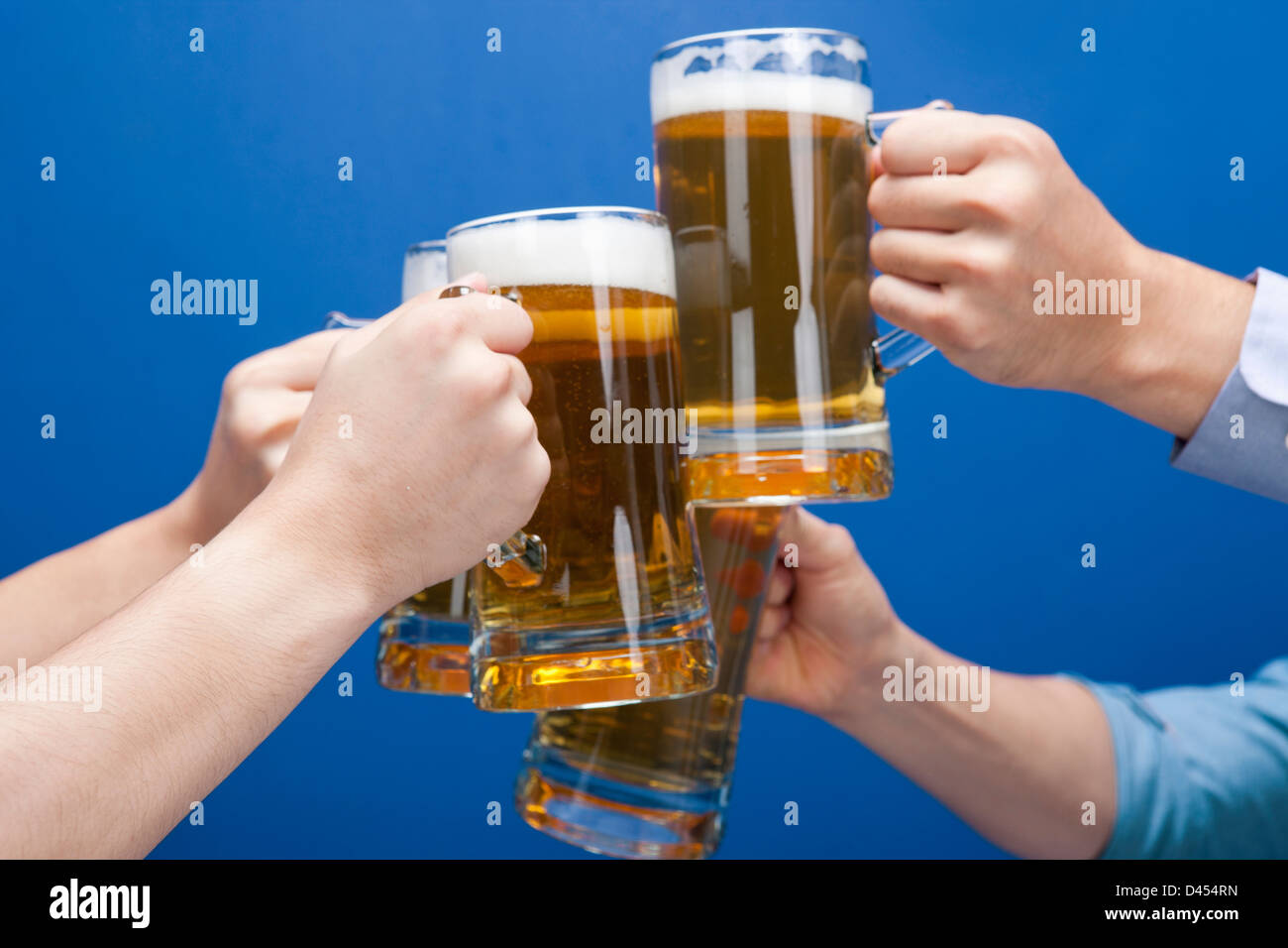 hands toasting with beer Stock Photo - Alamy