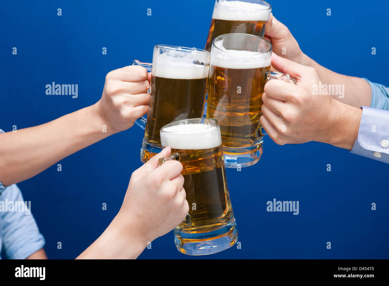 hands toasting with beer Stock Photo - Alamy
