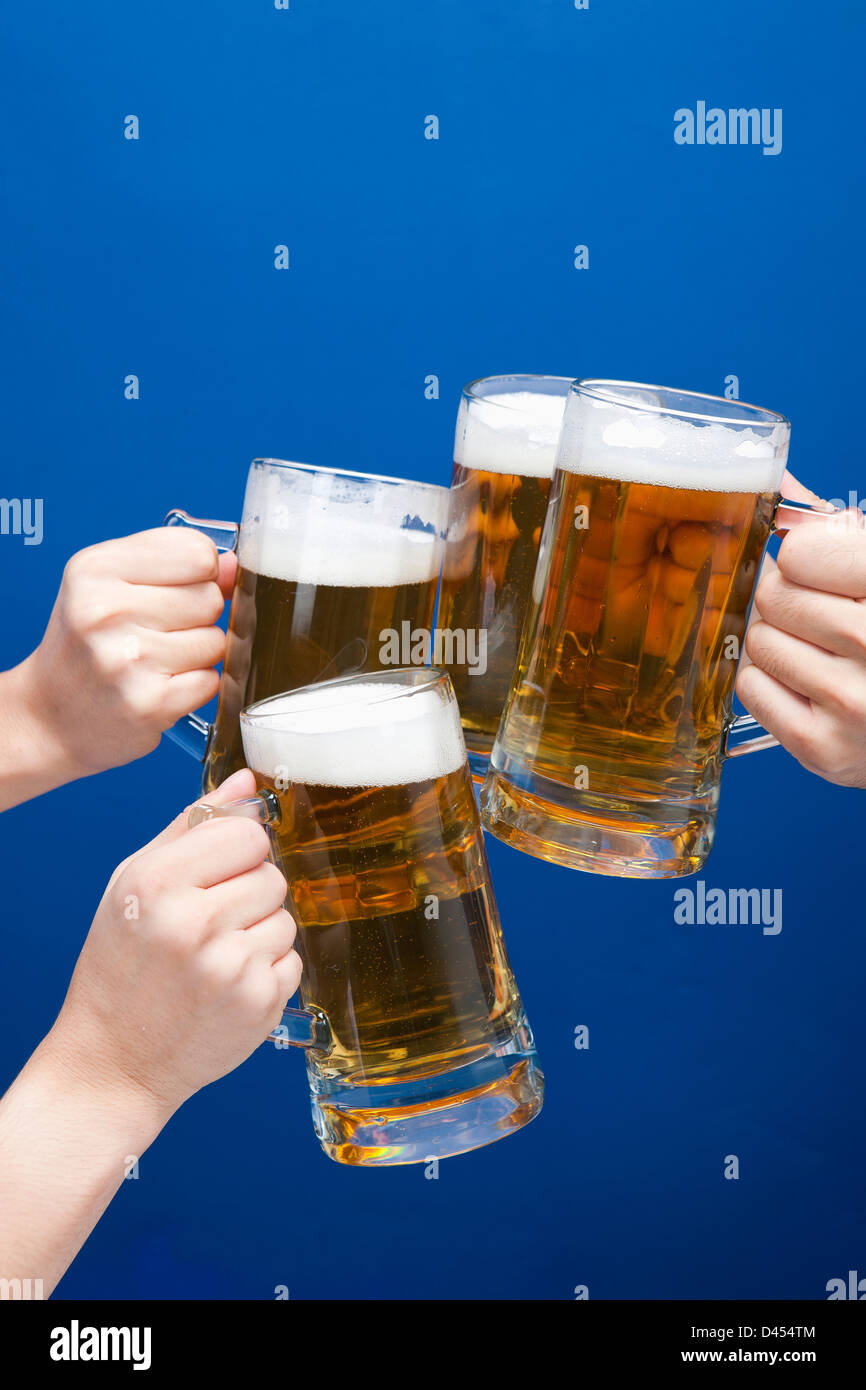 hands toasting with beer Stock Photo - Alamy