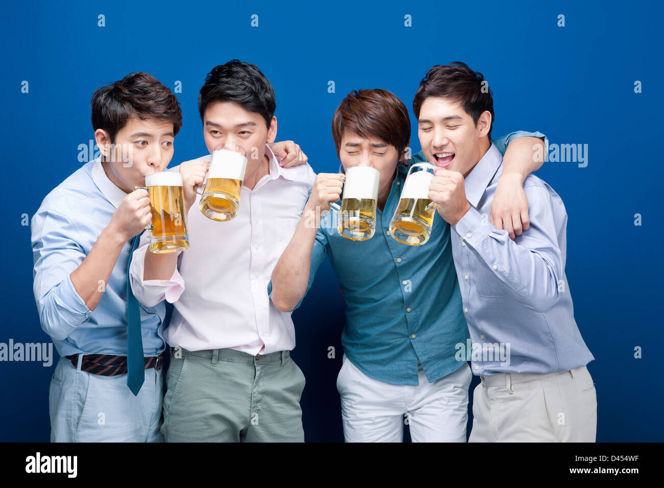 businessmen drinking beer together Stock Photo - Alamy