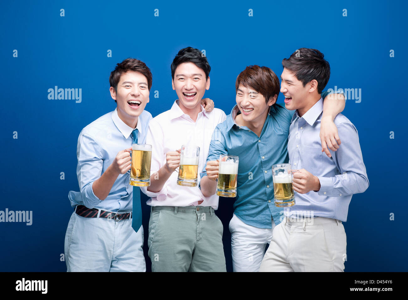 businessmen drinking beer together Stock Photo - Alamy