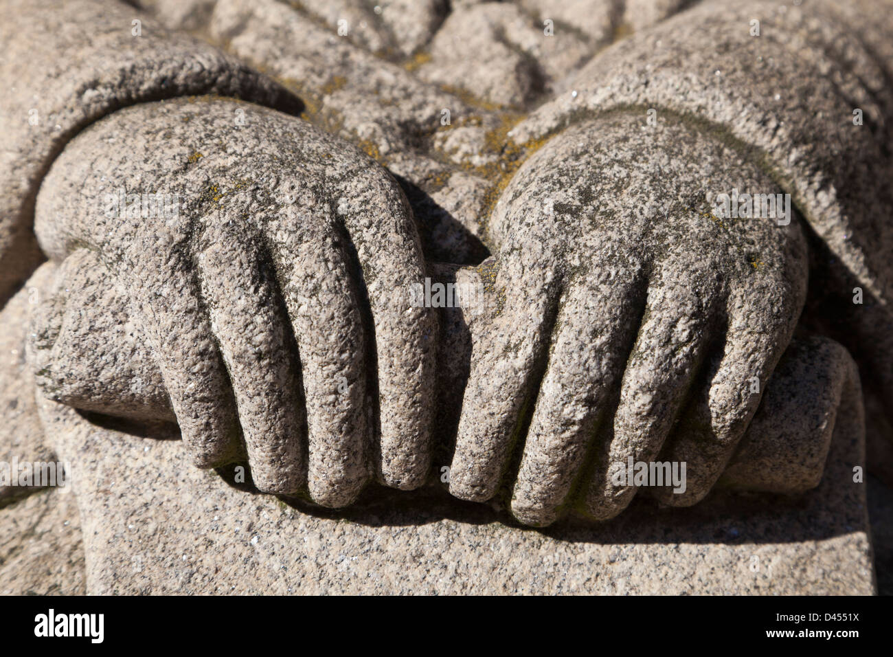hands of a statue, carved in stone Stock Photo - Alamy