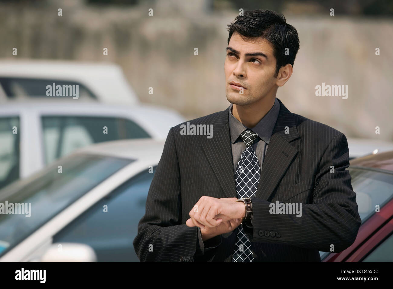 Businessman waiting outside the office Stock Photo - Alamy