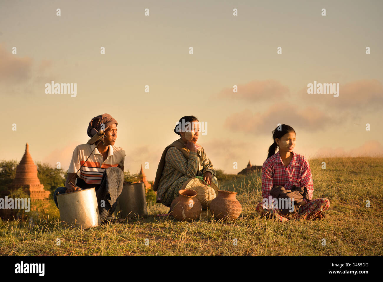traditional asian farmer coming back from a harvest rice field in bagan ...