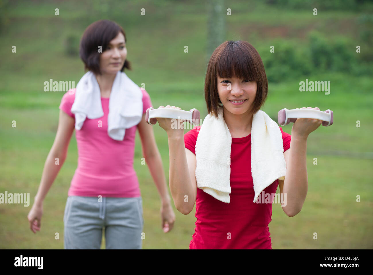 chinese girls workout outdoor inside a green park Stock Photo - Alamy