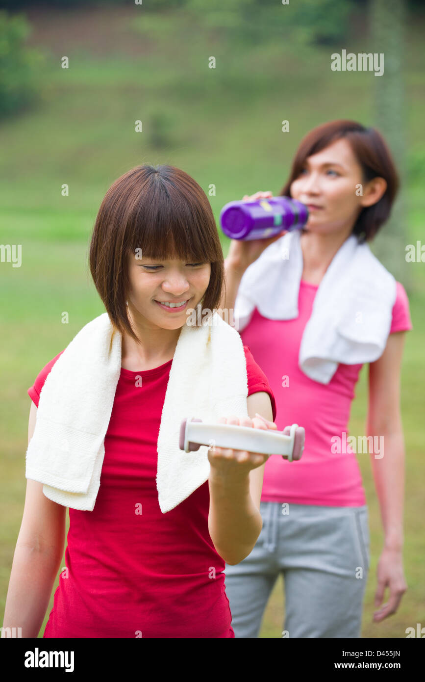 chinese girls workout outdoor inside a green park Stock Photo - Alamy