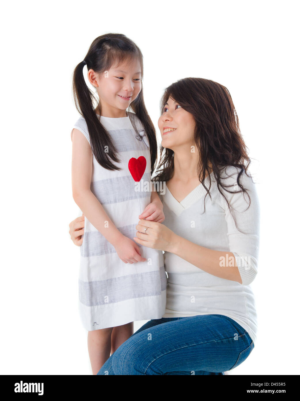 korean mother and her daughter with isolated background during mother's ...