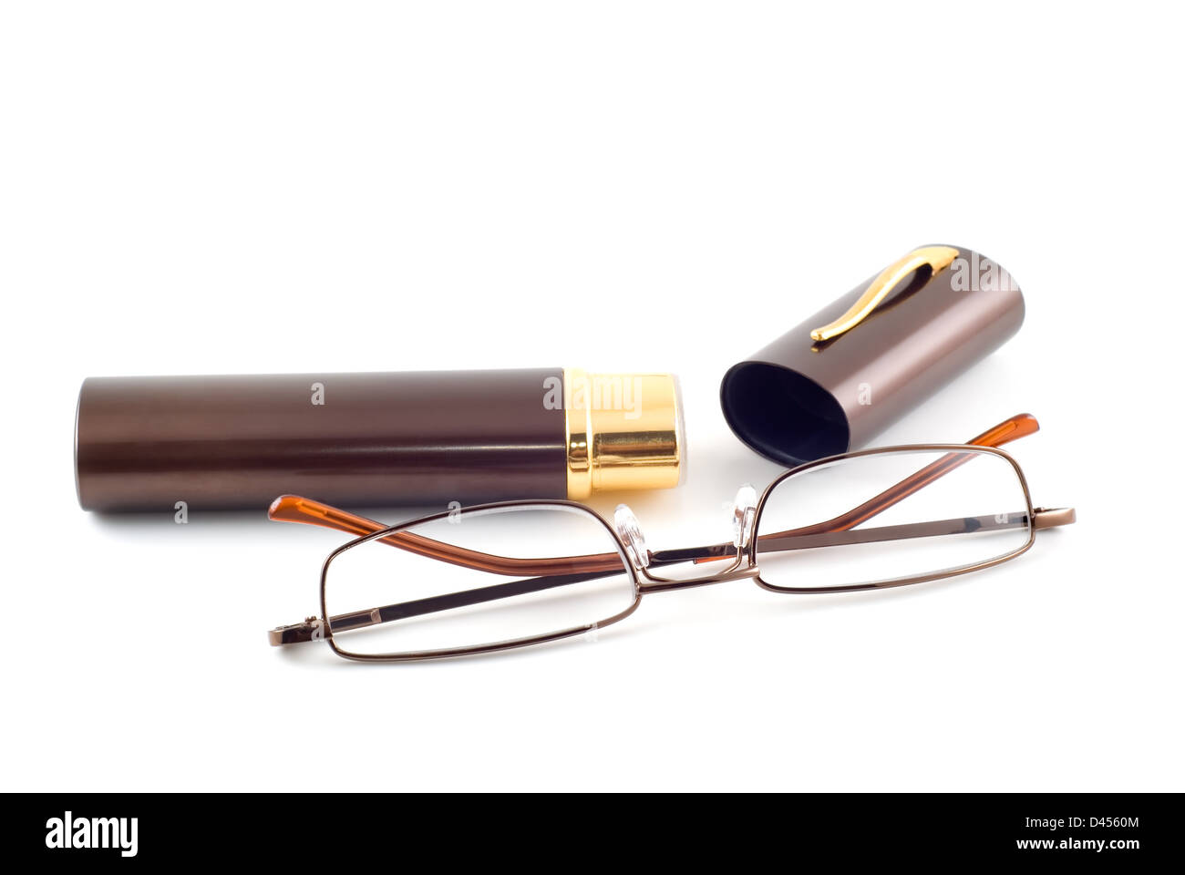 Spectacles and spectacle-case are photographed close-up on the white ...