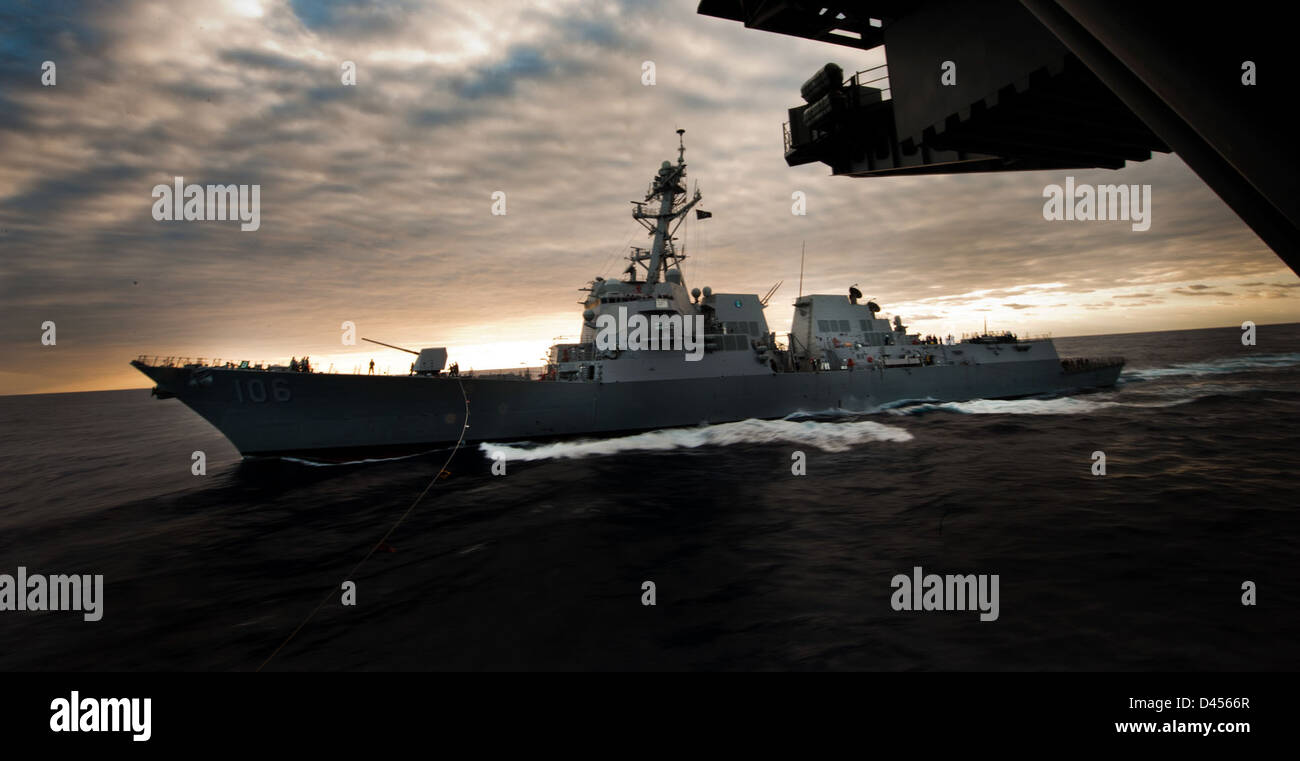 The USS Stockdale, a Navy destroyer, conducts refueling operations ...