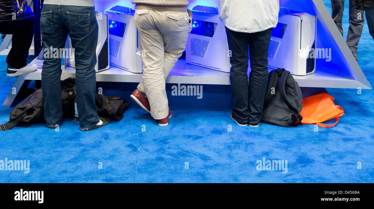 Expo visitors play computer games at the booth of Intel at the world's ...