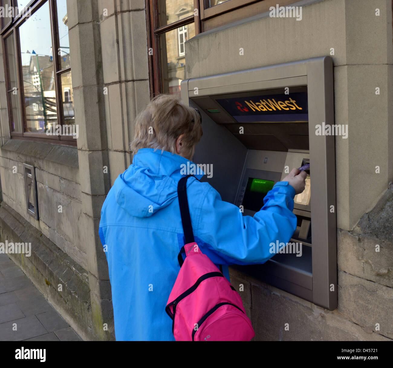 Using a cash dispenser hi-res stock photography and images - Alamy