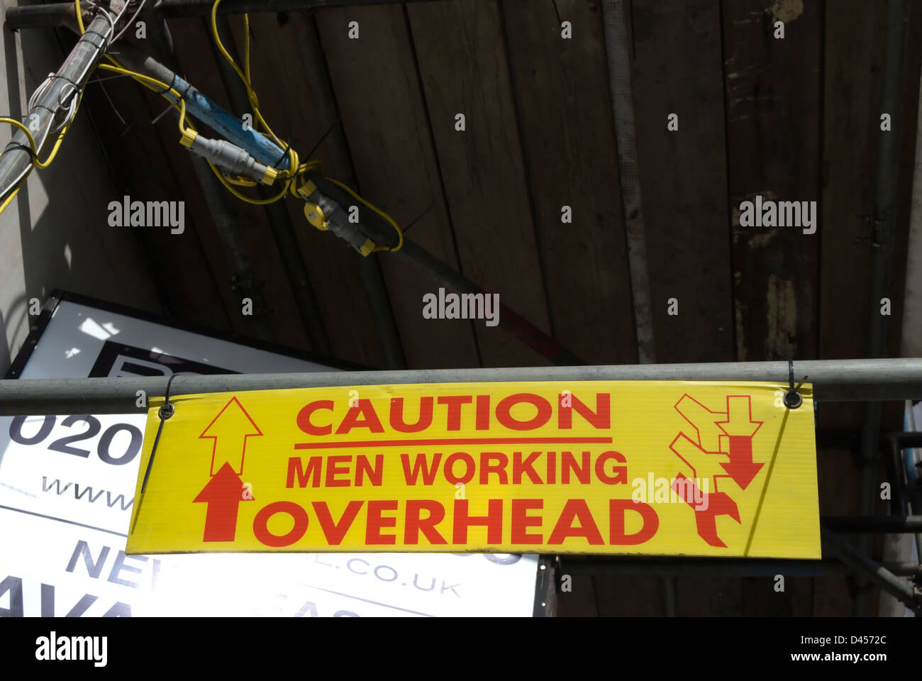 Caution men working overhead hi-res stock photography and images - Alamy