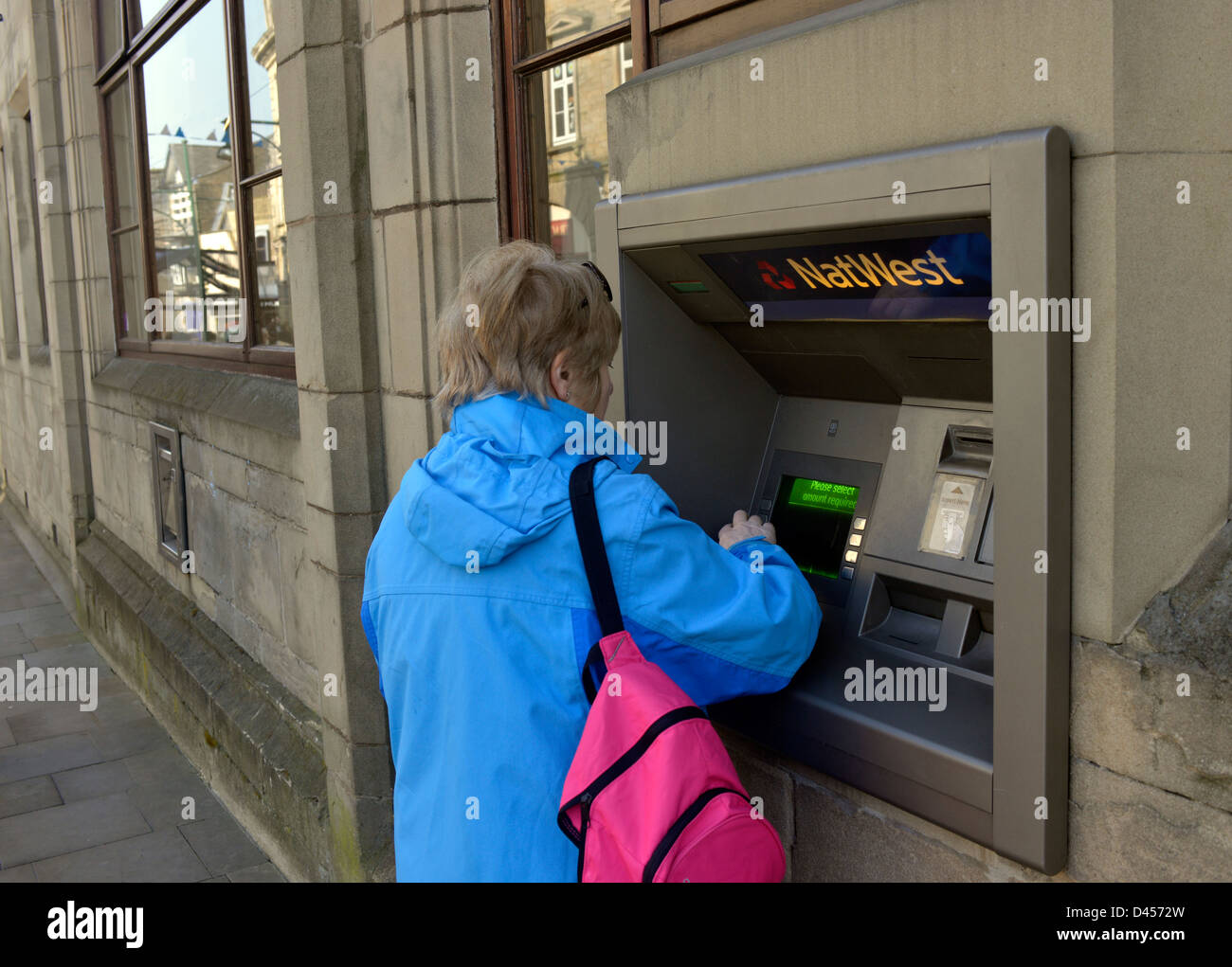Using a cash dispenser hi-res stock photography and images - Alamy