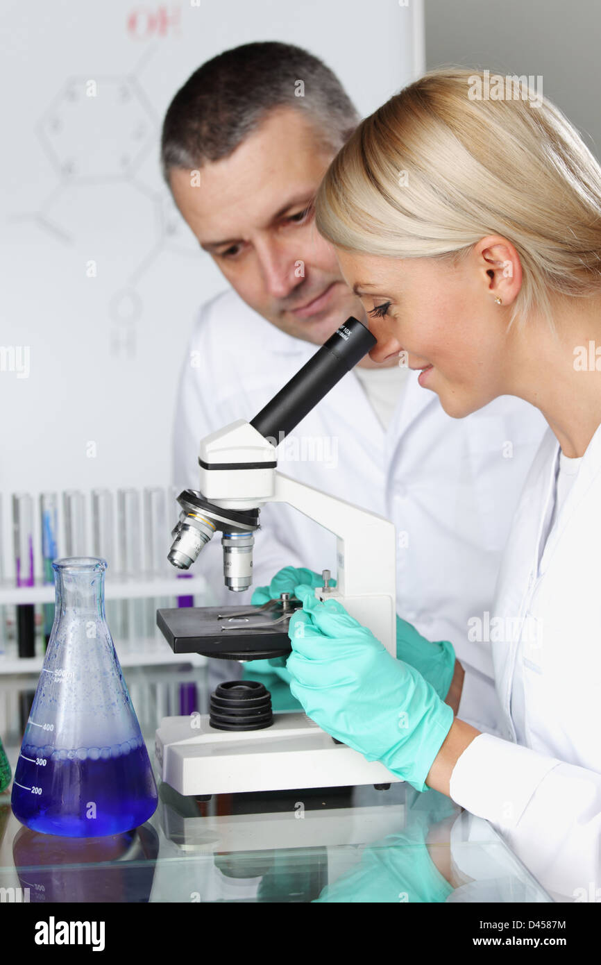 two scientist in chemical lab conducting experiments Stock Photo - Alamy