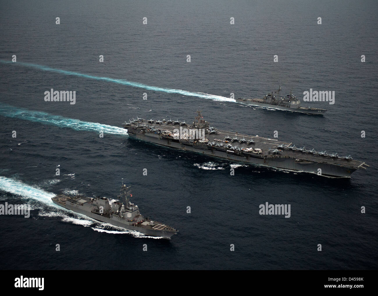 U.S. Navy ships maneuver into formation while transiting the Atlantic ...