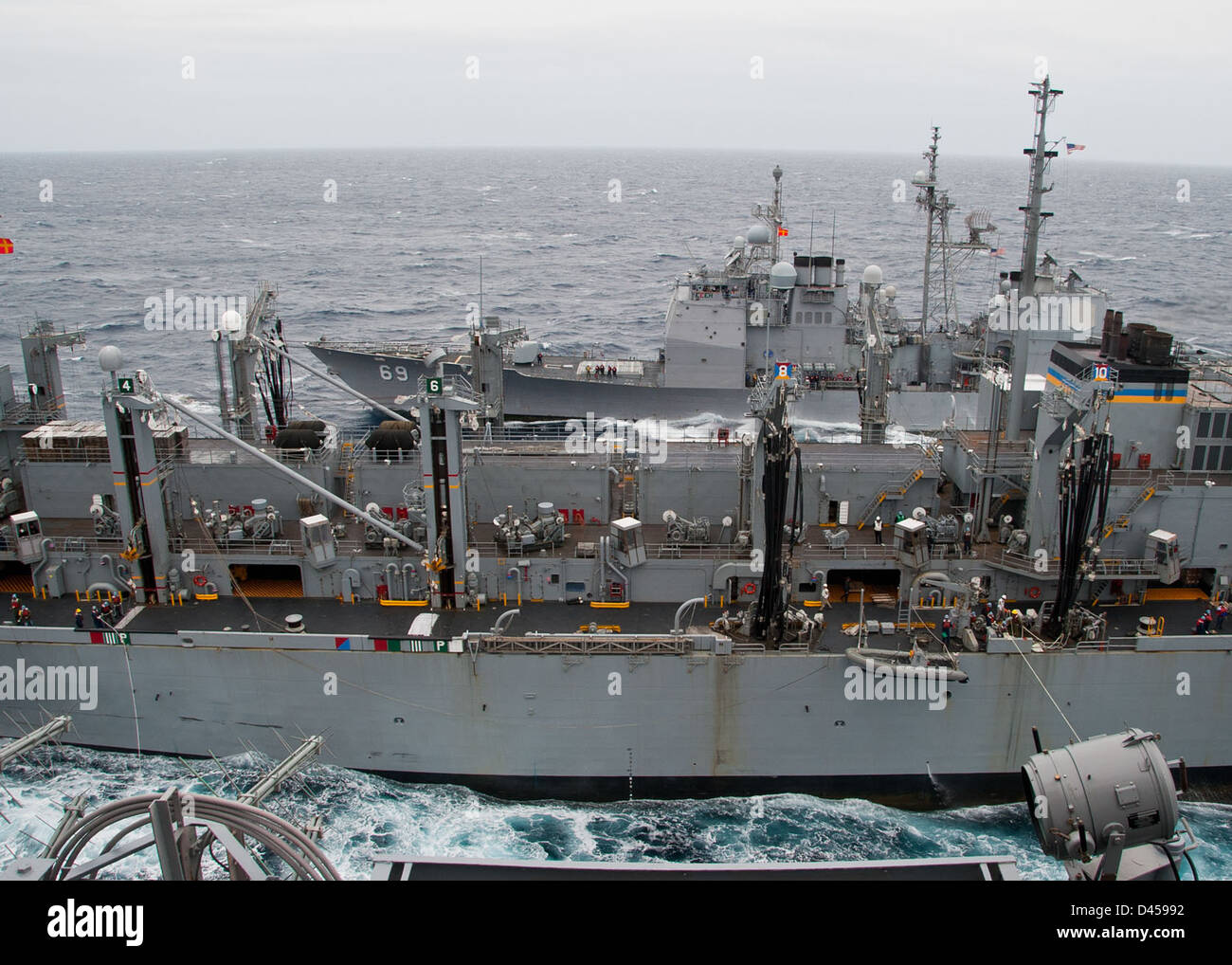 U.S. Navy ships conduct replenishment at sea, refueling and resupplying ...