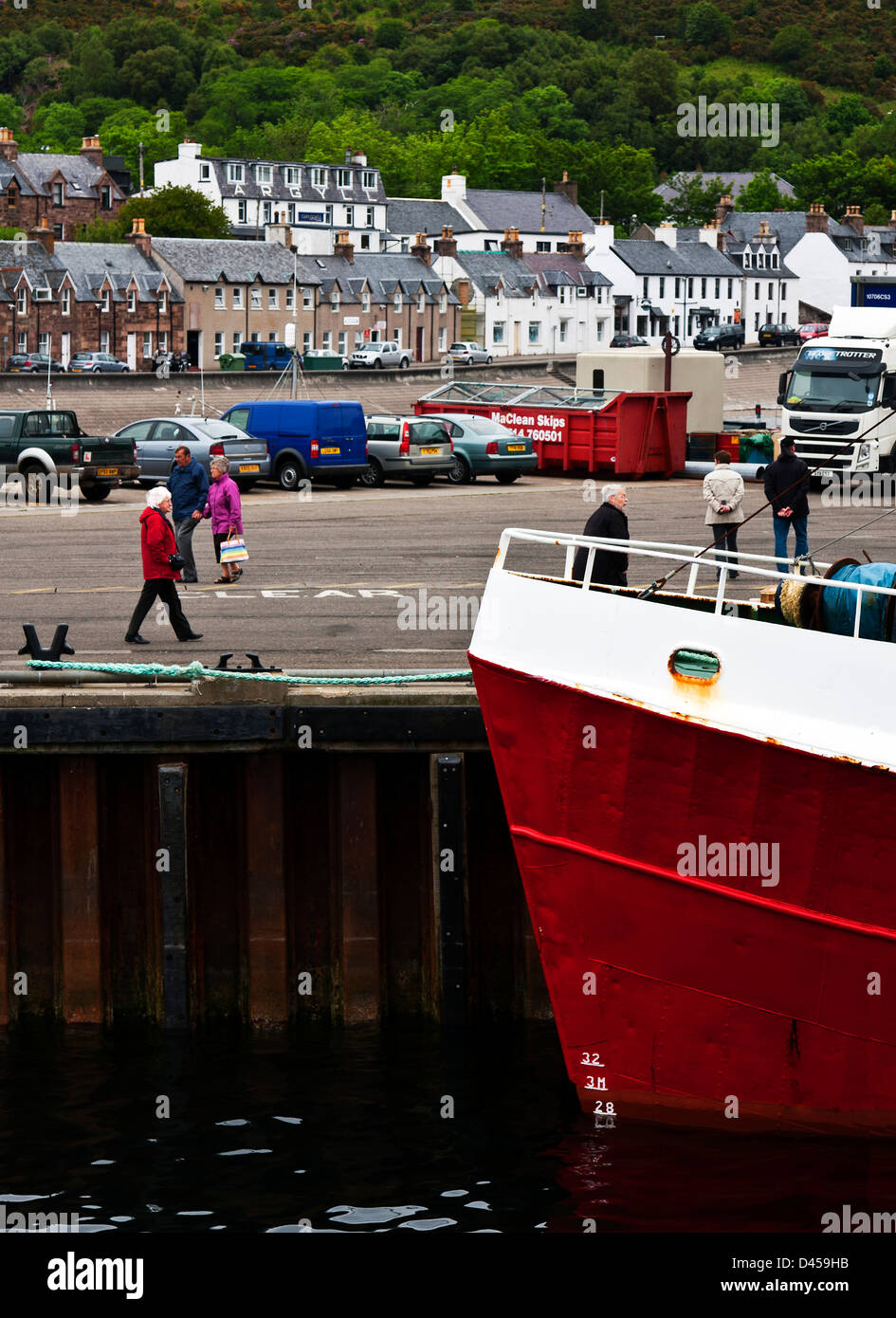 Ullapool, Scotland, towns people strolling on the town wharf with the ...