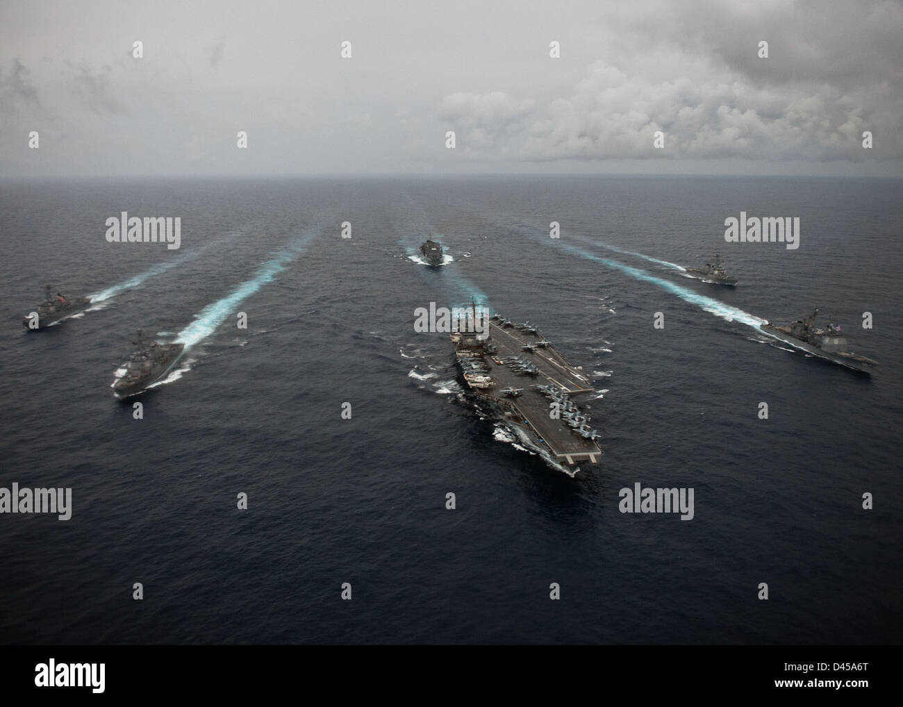 U.S. Navy ships maneuver into formation as they transit the Atlantic ...