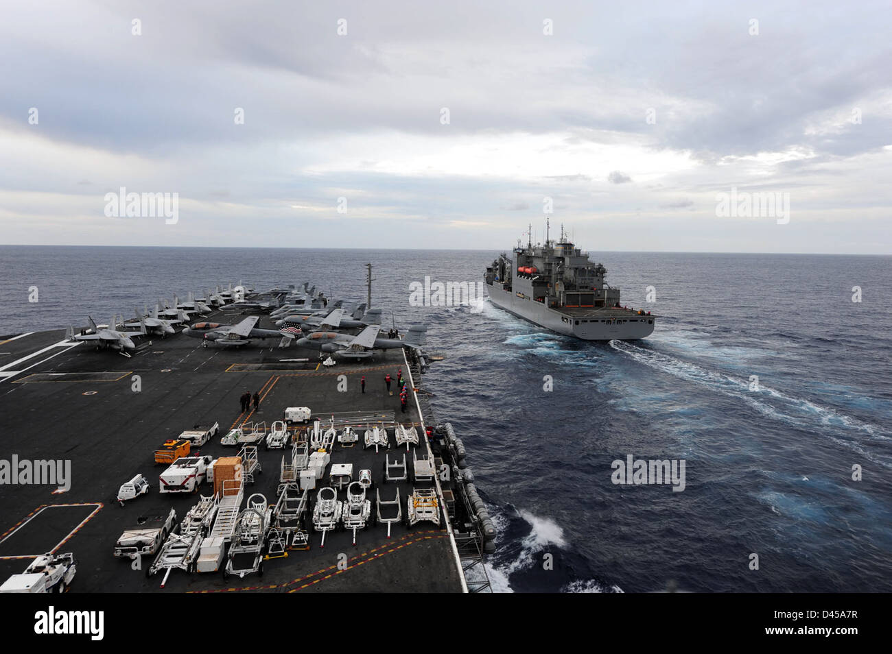 The USNS Sacagawea transits alongside the USS Dwight D. Eisenhower in ...