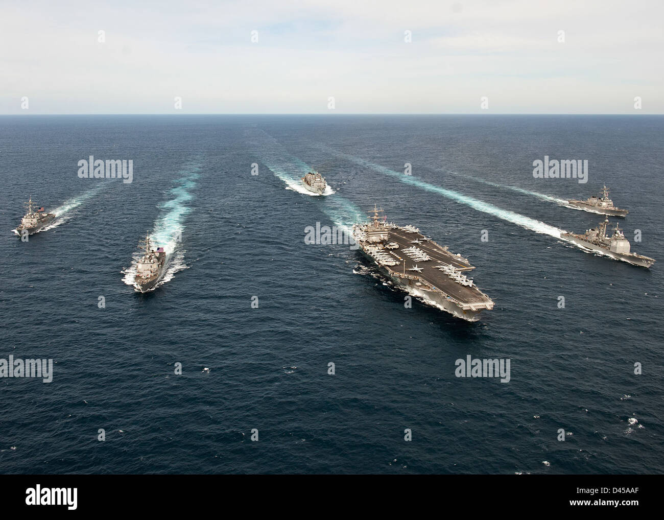 U.S. Navy ships maneuver into position while transiting the Atlantic ...