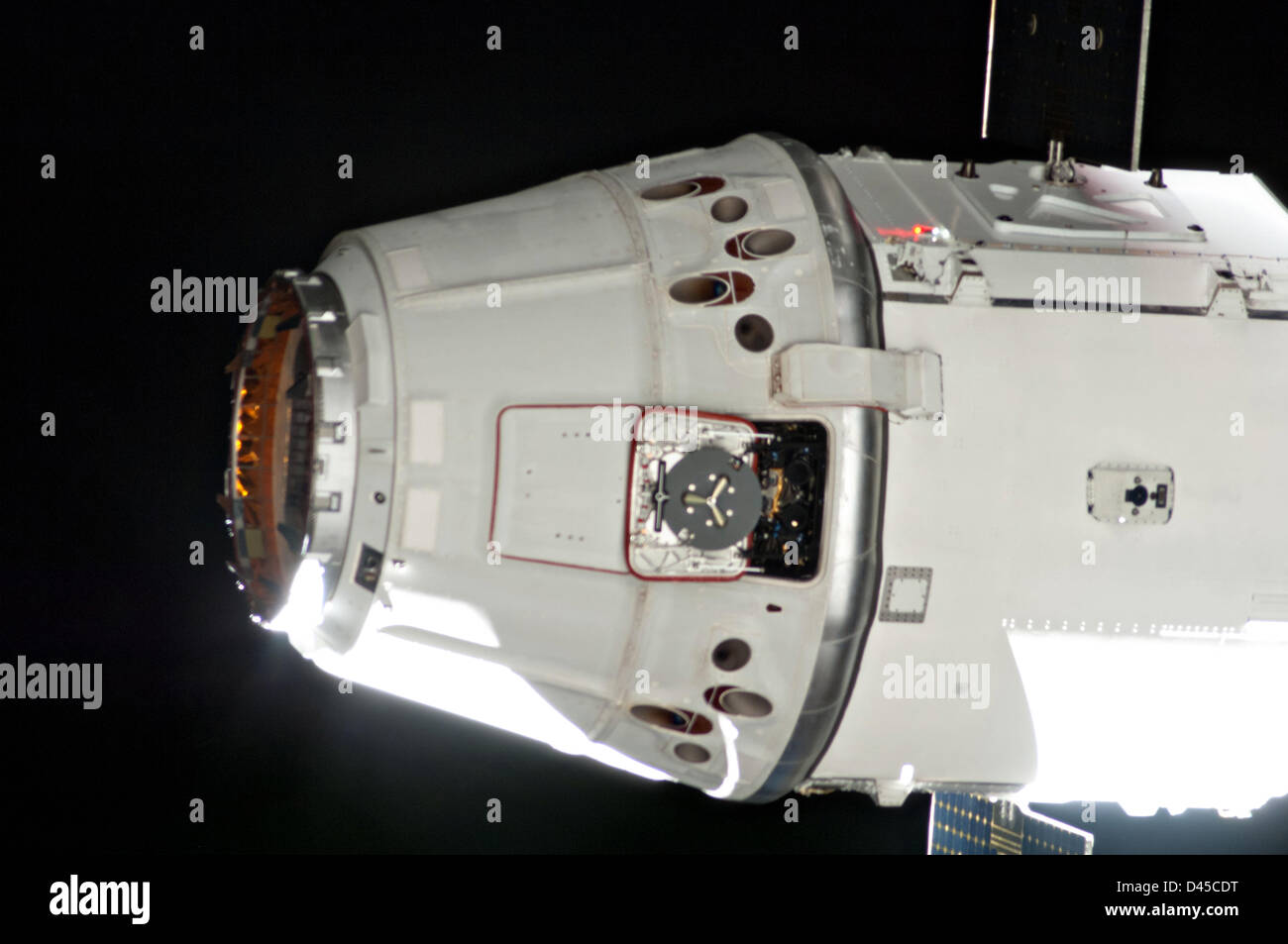 View of the SpaceX Dragon capsule captured by the robotic arm of the ...