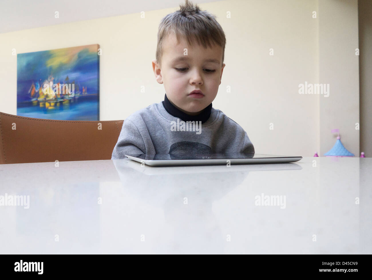 Small boy using an Apple iPad Stock Photo - Alamy