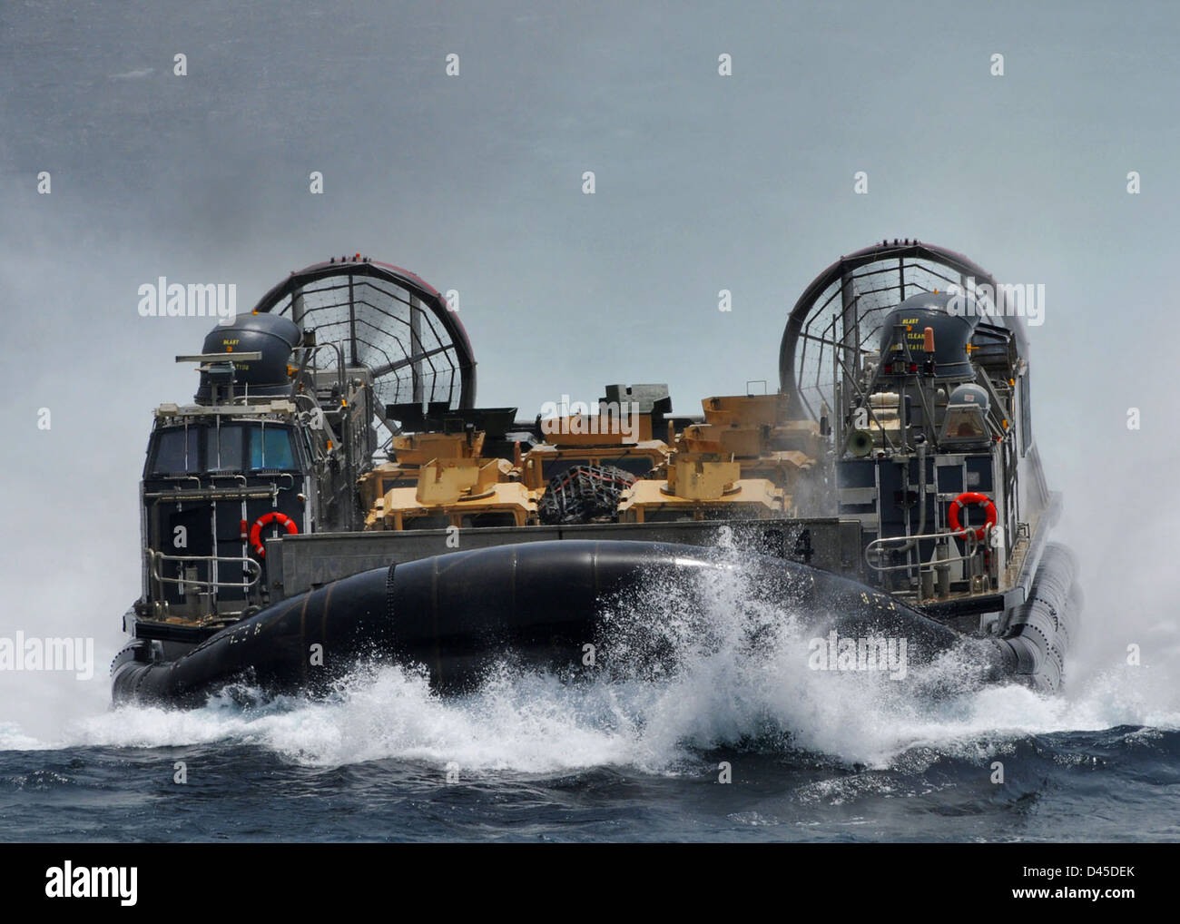 A landing craft air cushion (LCAC) returns to the welldeck of a U.S ...