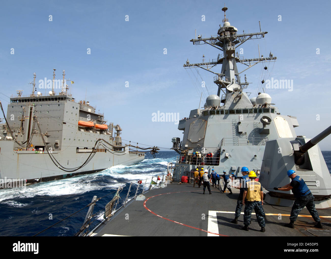 Sailors perform a replenishment at sea operation in the Fifth Fleet ...